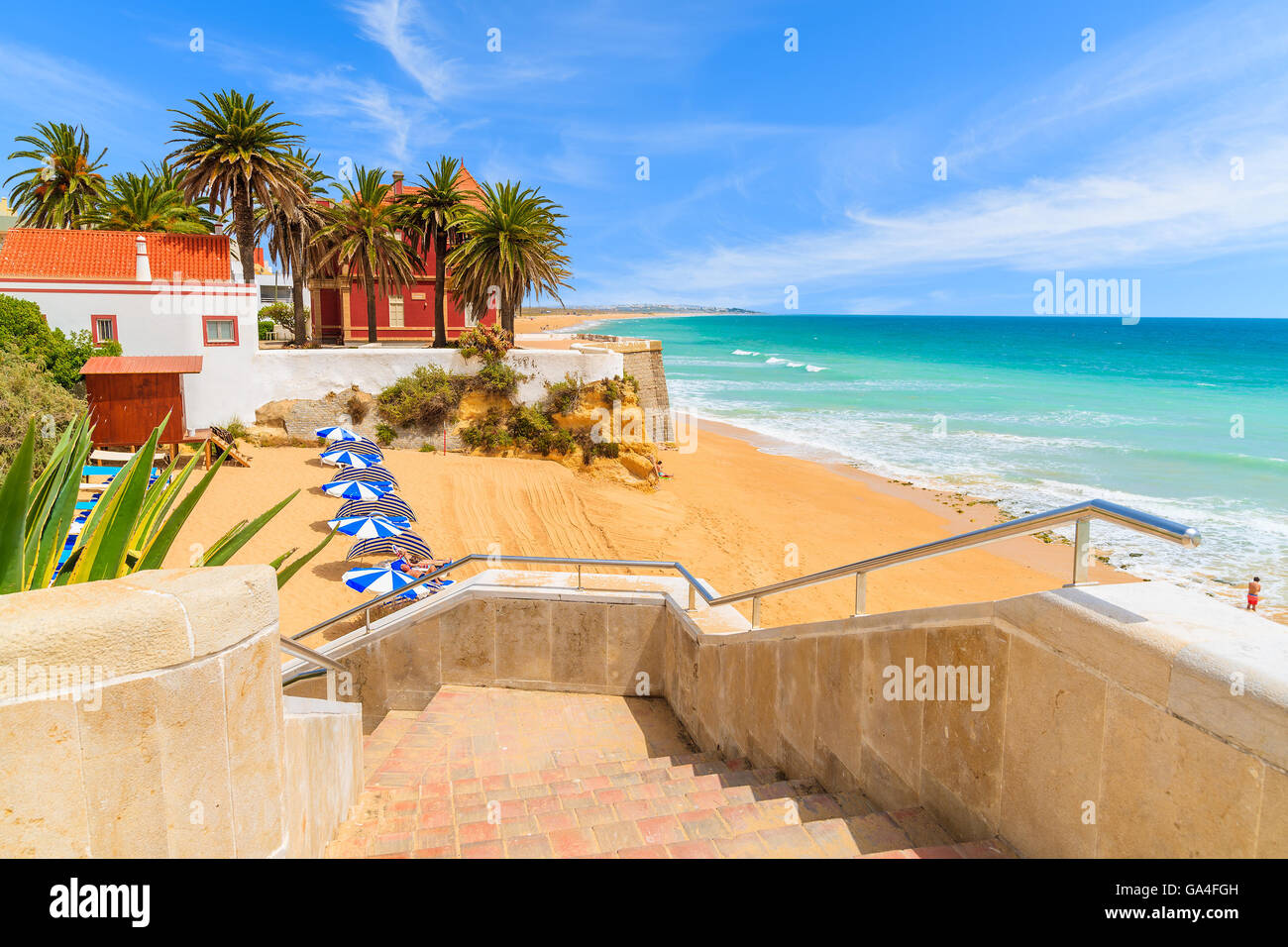 Steps to beautiful beach in Armacao de Pera coastal town, Algarve ...
