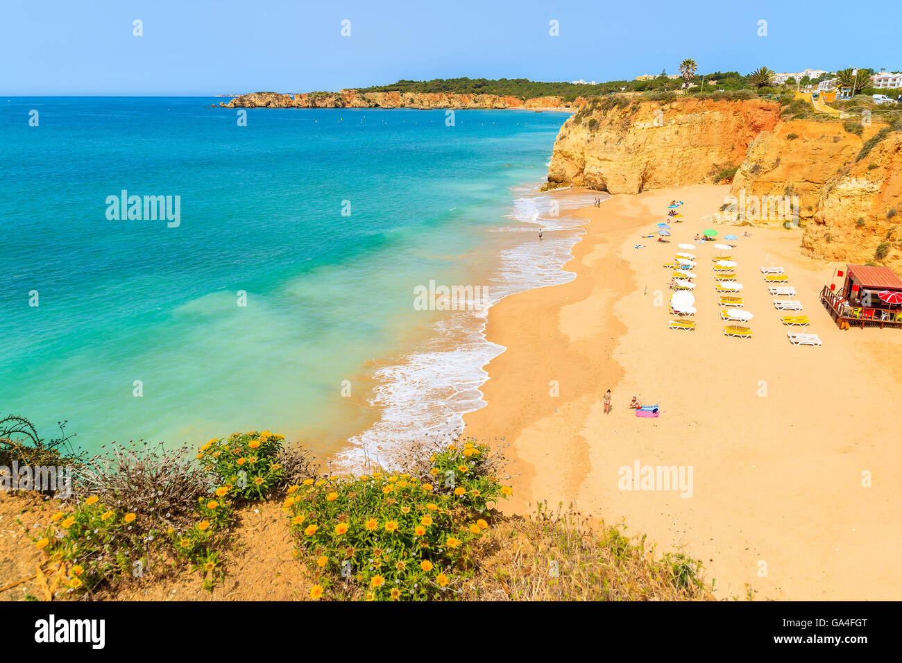 A view of a Praia da Rocha beach with golden cliffs in Portimao town ...