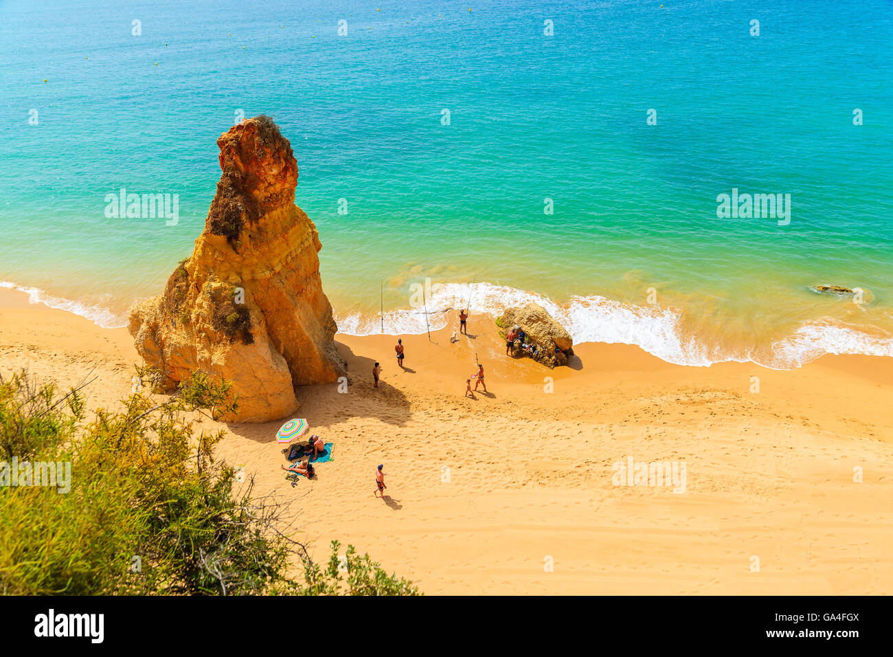A view of a Praia da Rocha beach with rock in ocean water in Portimao ...