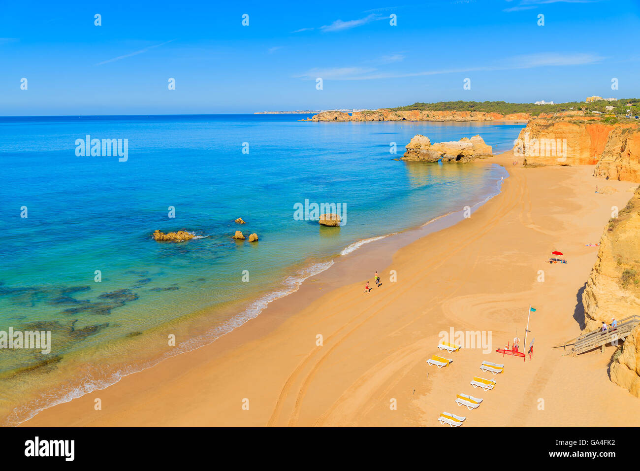A view of a Praia da Rocha beach with golden cliff rocks in Portimao ...