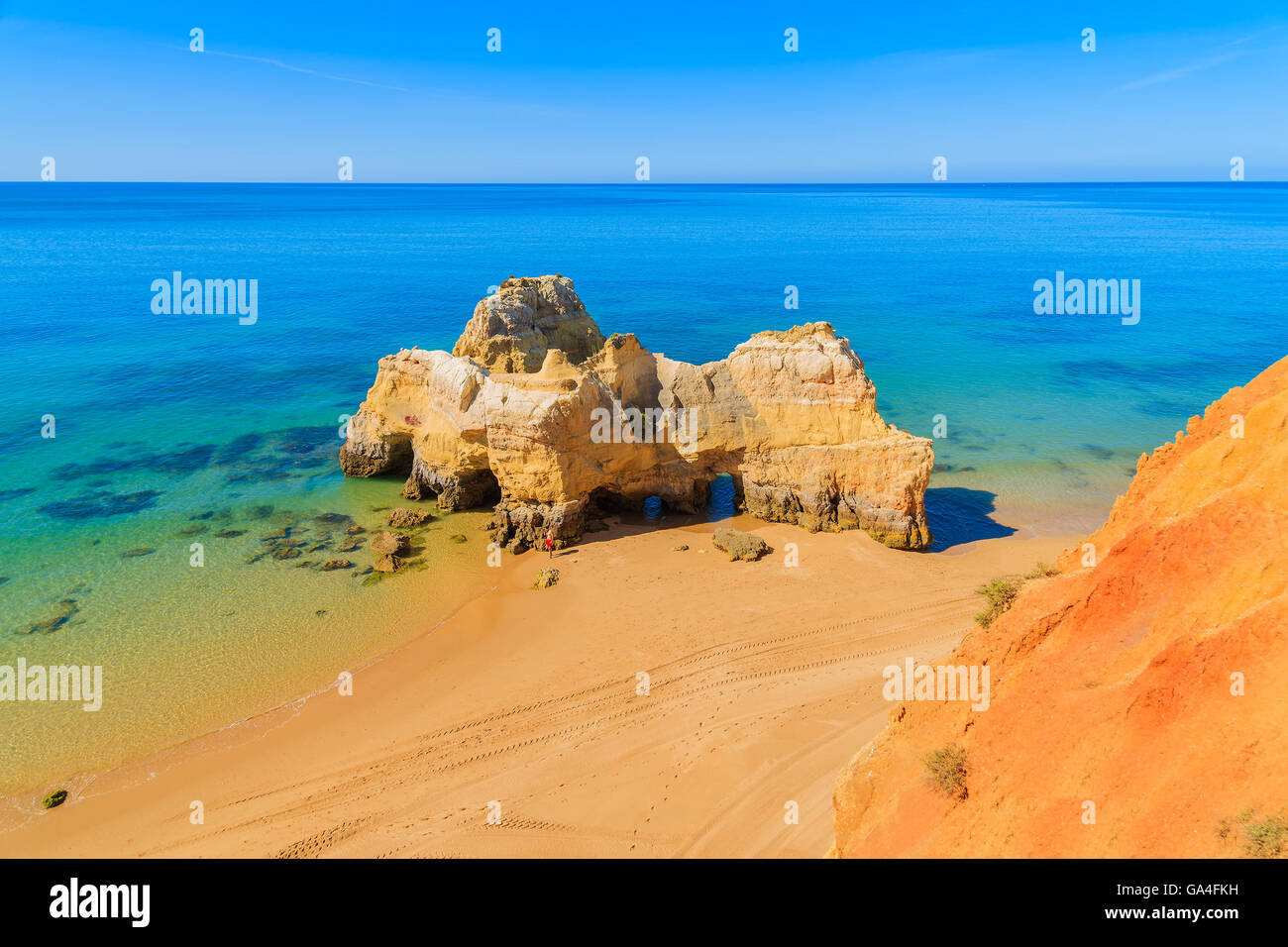 A view of a Praia da Rocha beach with golden cliff rocks in Portimao ...