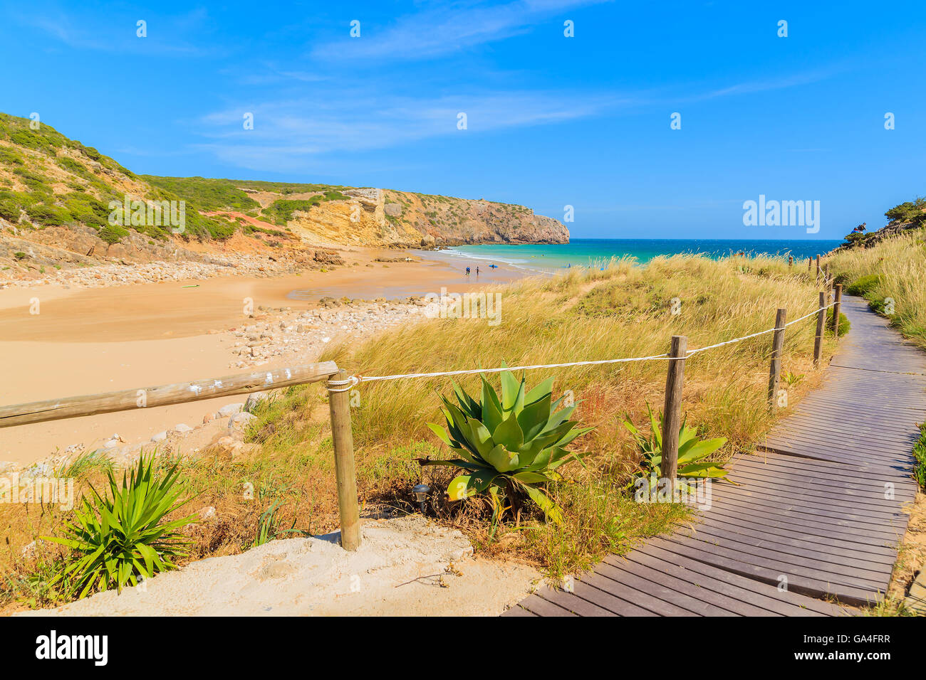 Walkway to Praia do Zavial beach on beautiful coast of Algarve region ...