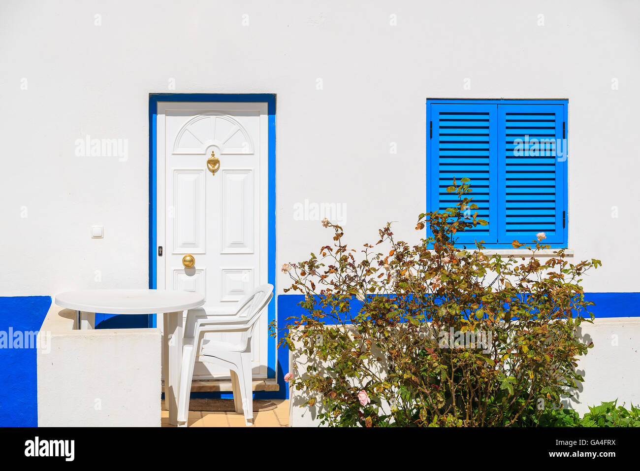 Typical white Greek house with blue window shutters, Kefalonia island ...