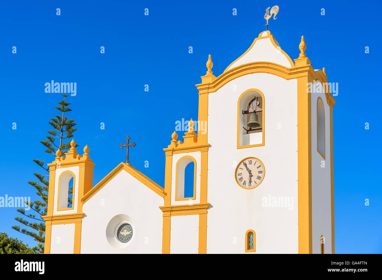 Facade of typical church in Luz town on coast of Algarve region ...