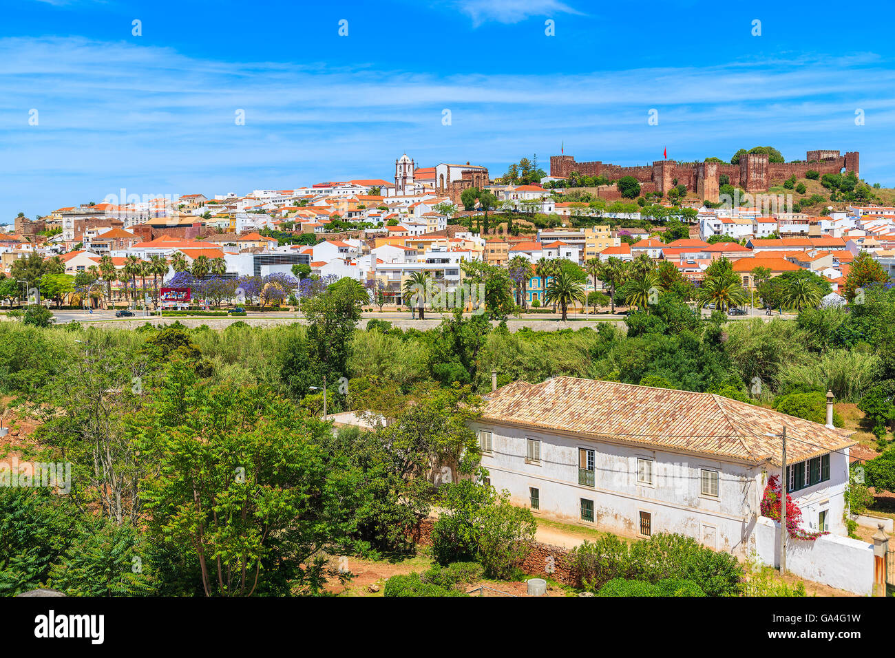 A view of Silves town buildings with famous castle and cathedral ...