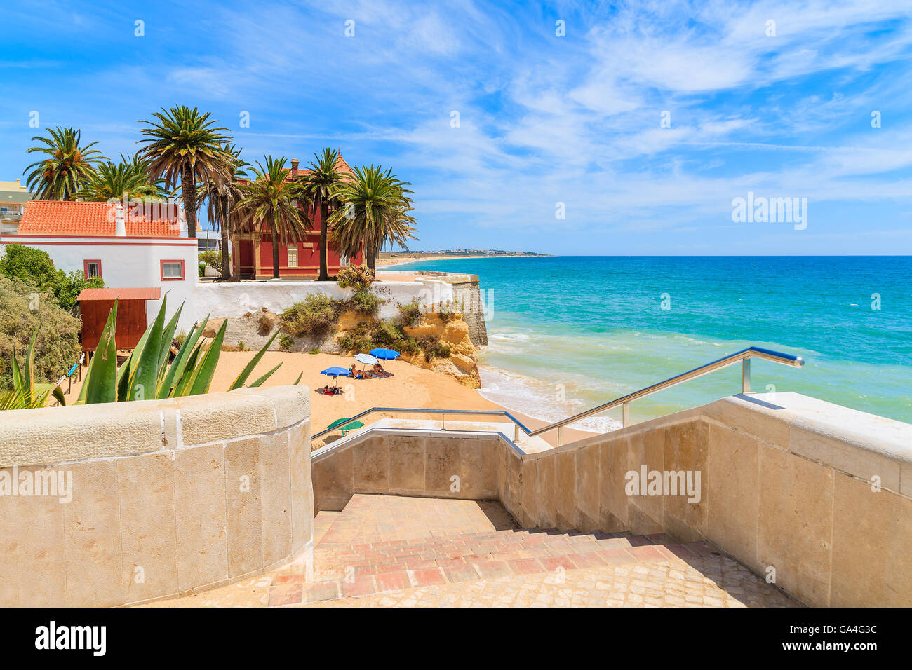 Steps to beautiful beach in Armacao de Pera coastal town, Algarve ...