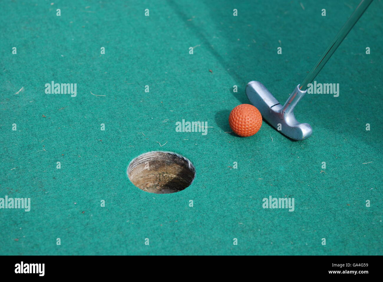 Miniature golf orange ball Stock Photo - Alamy