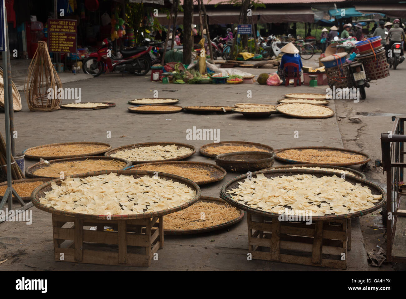 Vietnamese people dry food in the sun Stock Photo - Alamy