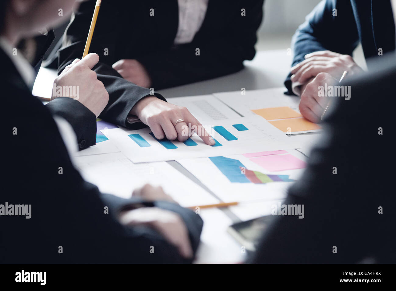 Sitting behind desk hi-res stock photography and images - Alamy