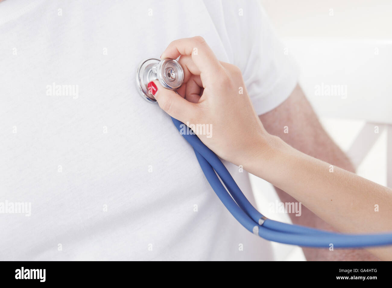 Doctor examining heartbeat with stethoscope, close-up view Stock Photo ...