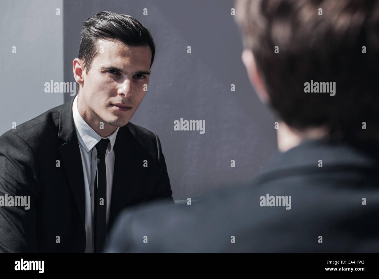 Two Business men talking at office Stock Photo - Alamy