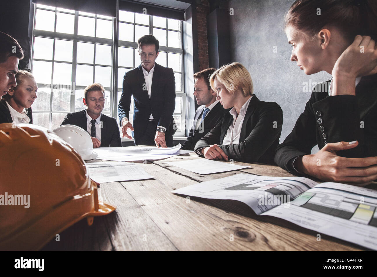 Business people group on meeting with construction engineer architect ...