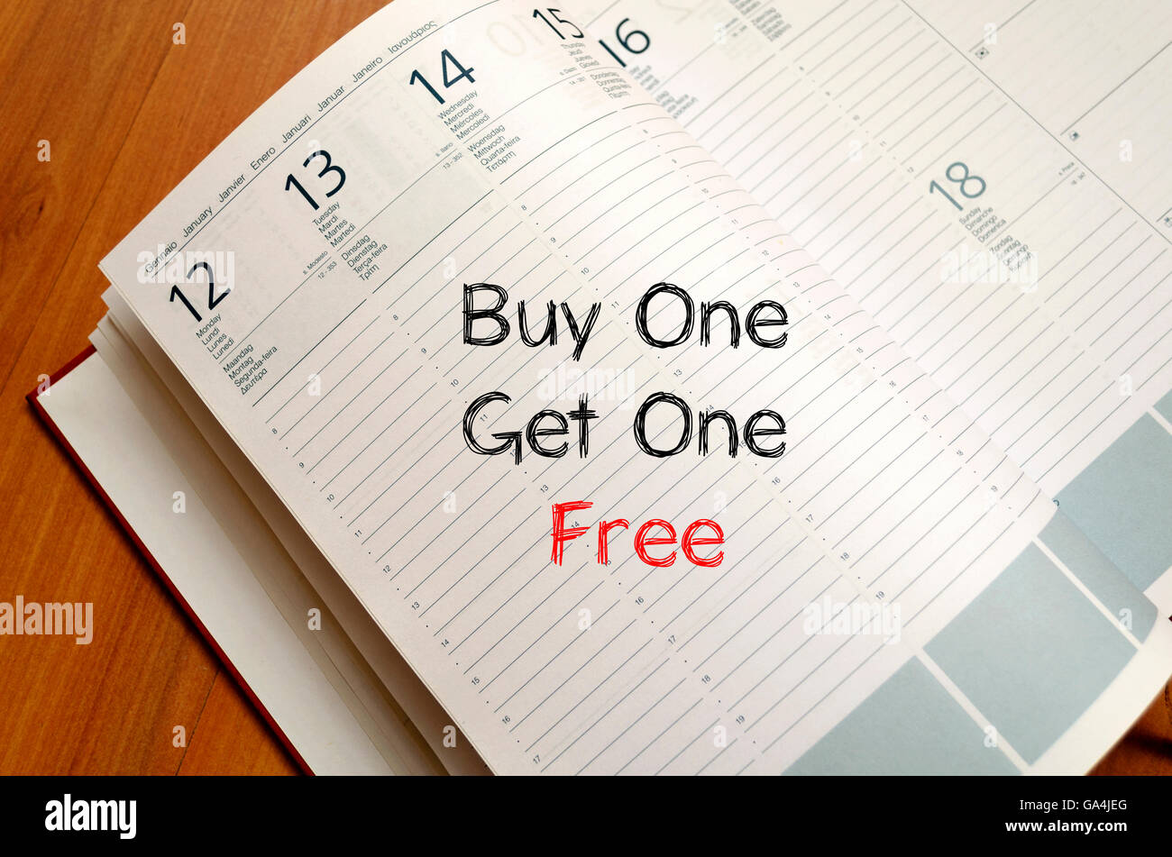 Buy one get one free text concept write on notebook Stock Photo - Alamy