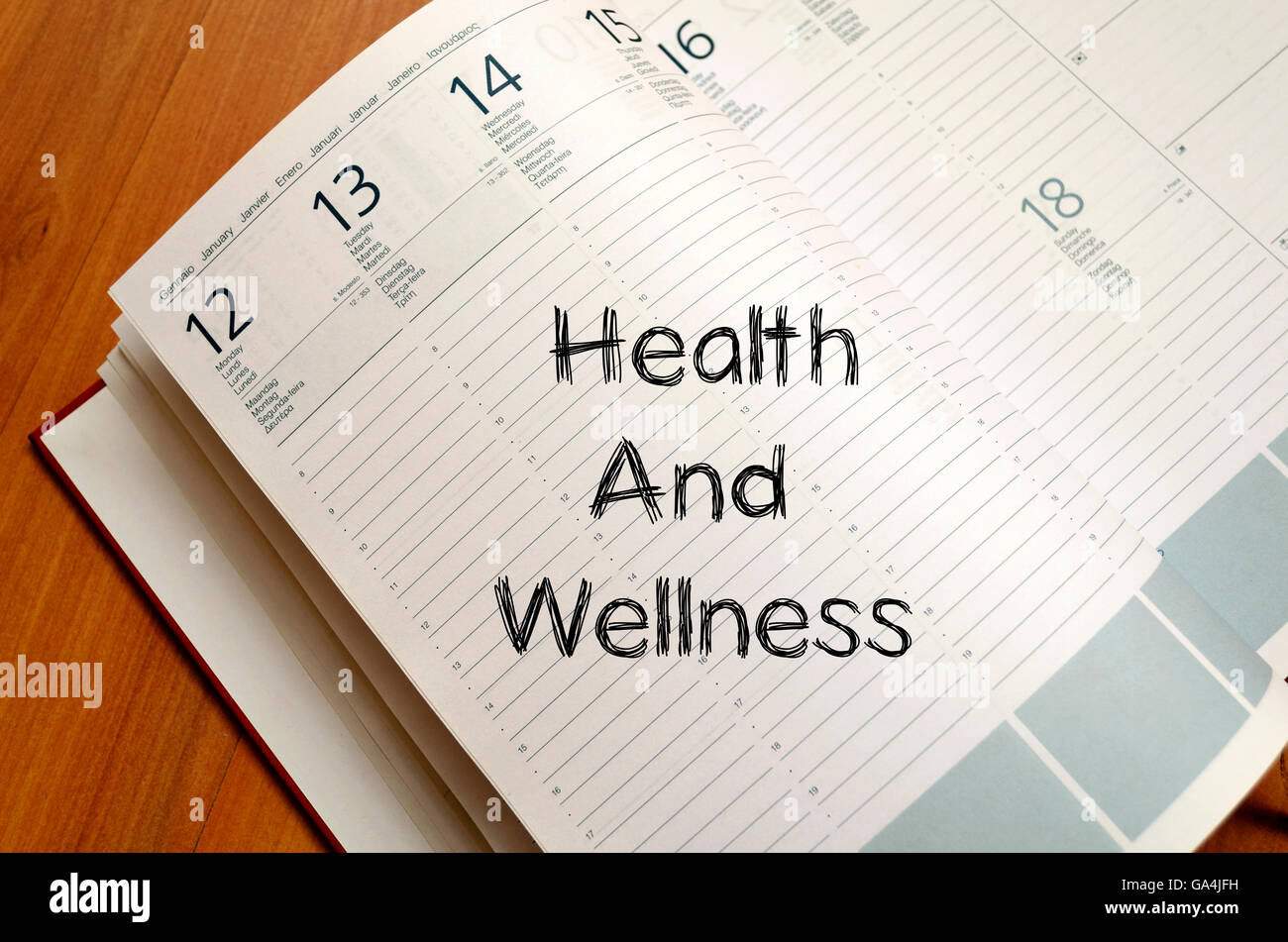 Health and wellness text concept write on notebook Stock Photo - Alamy