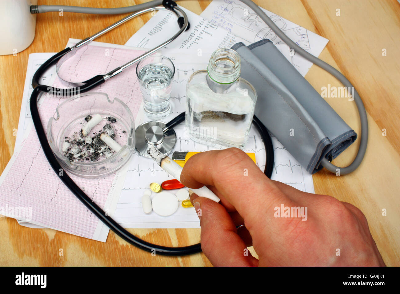 Cigarette in hand sick smoker and an alcoholic Stock Photo - Alamy