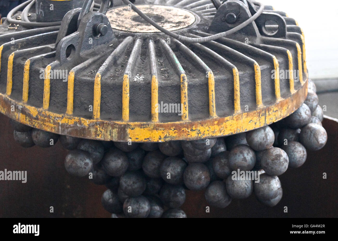 Magnet holds grinding balls when loading Stock Photo - Alamy