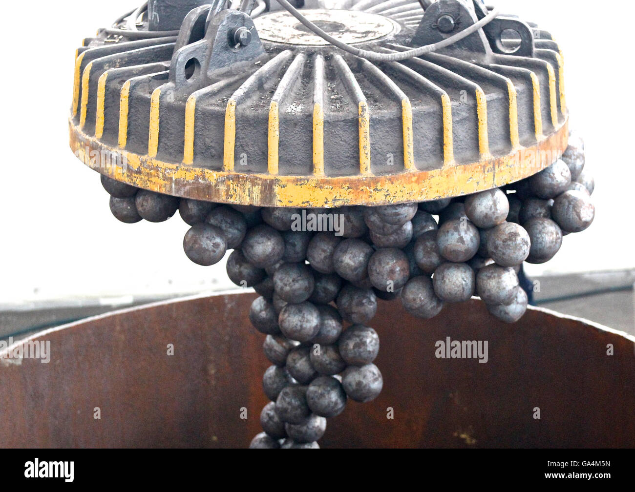 Magnet holds grinding balls when loading Stock Photo - Alamy