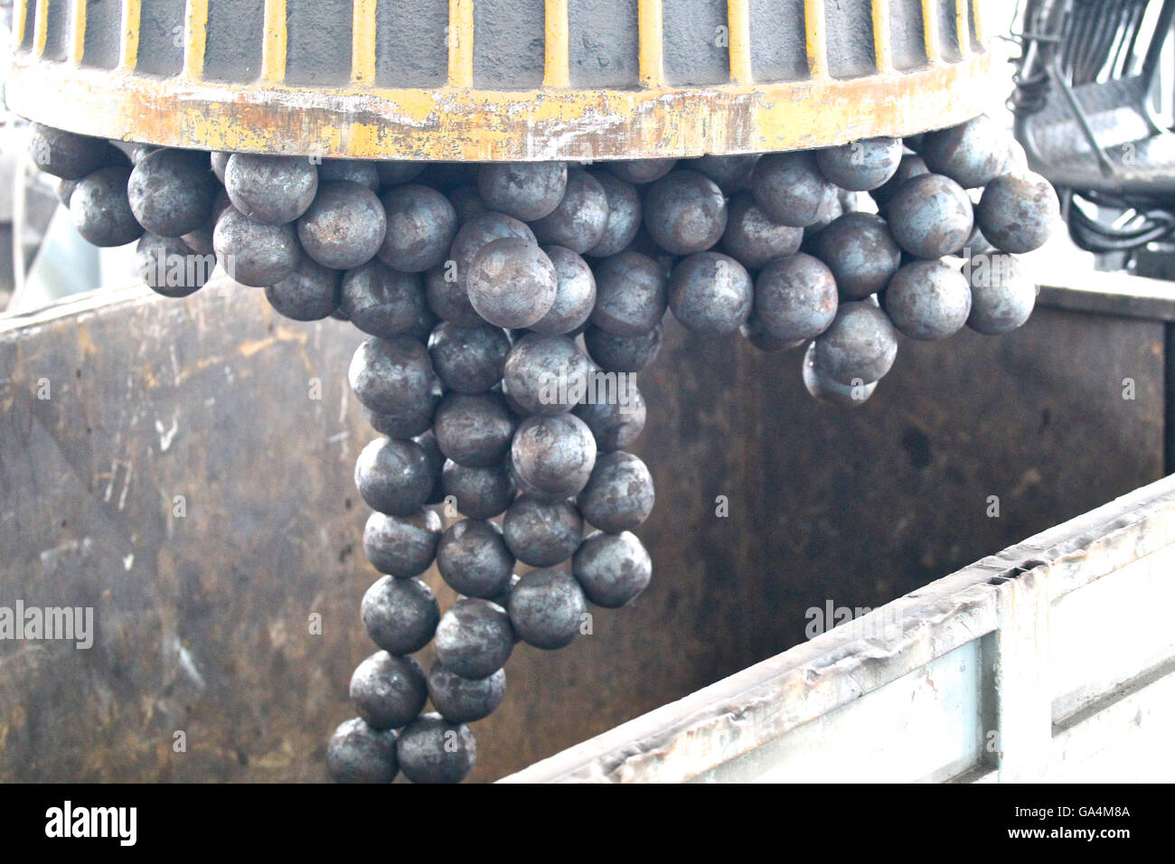 Magnet holds grinding balls when loading Stock Photo - Alamy