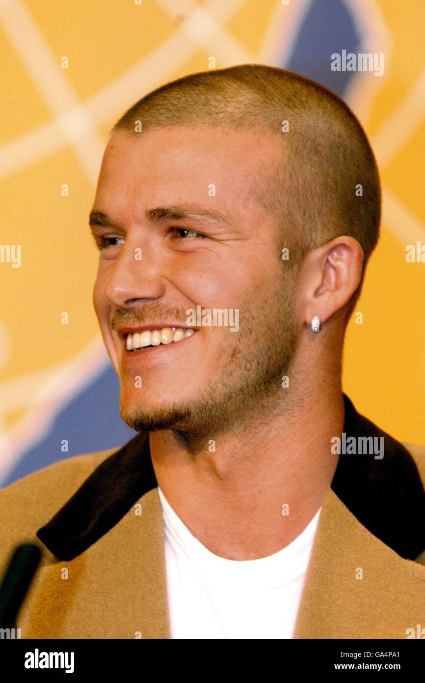Manchester United and England's David Beckham is all smiles as he comes ...