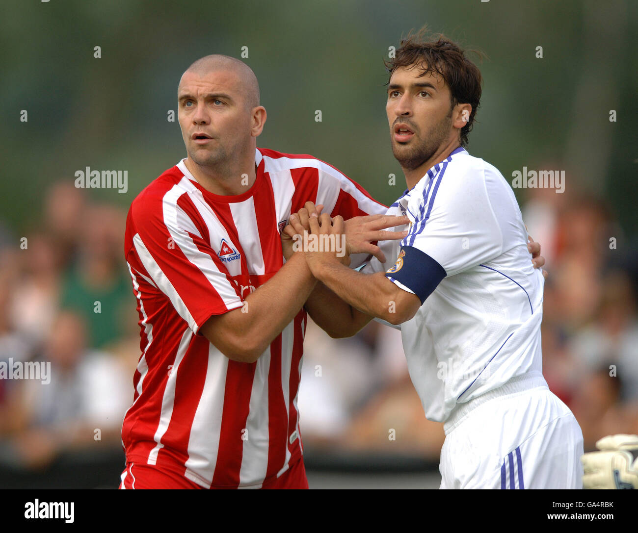 Stoke City's Dominic Matteo gets to grips with Real Madrid's Raul Stock ...