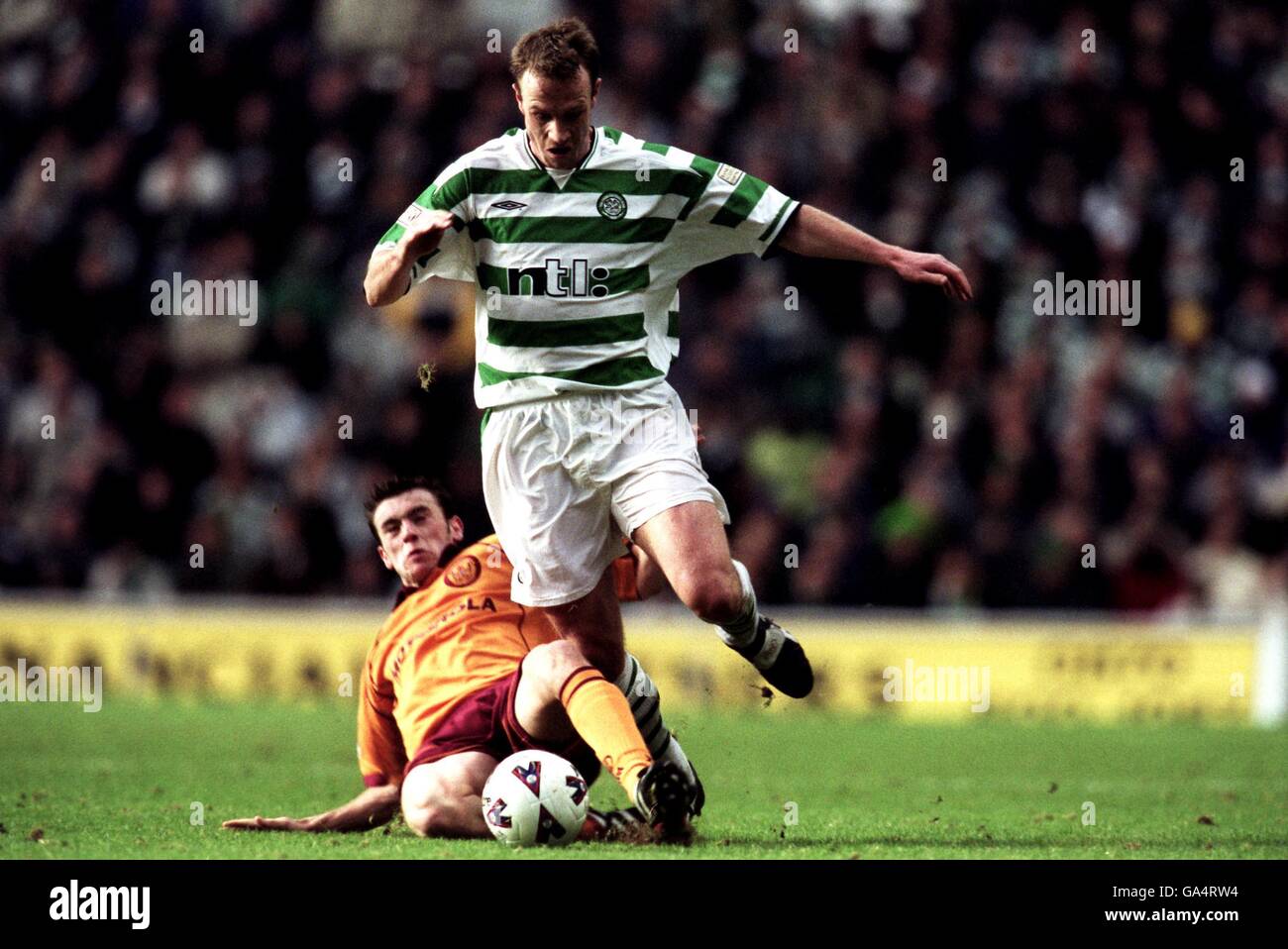 Celtic's Joos Valgaeren is tackled by Motherwell's Greg Strong Stock ...