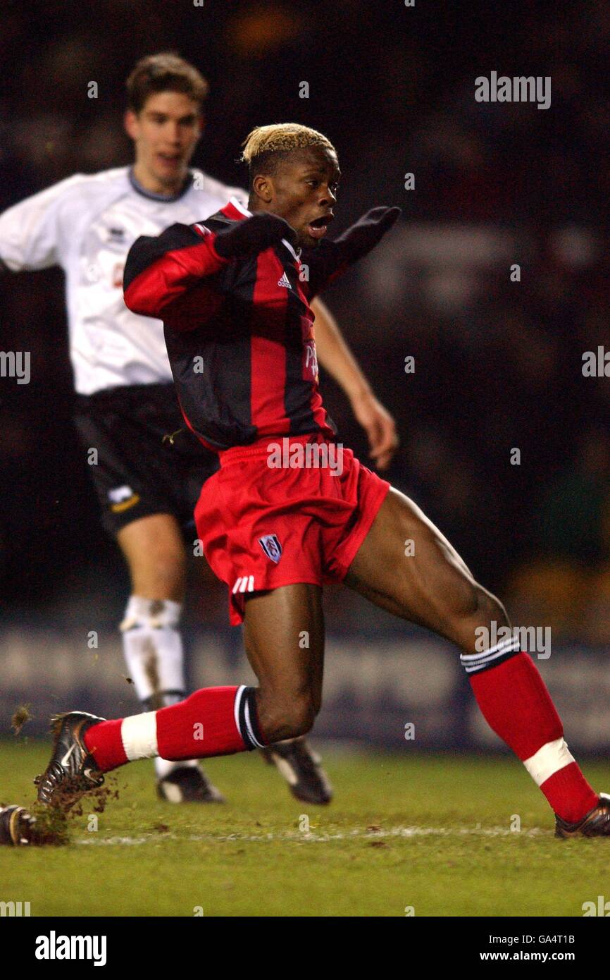 Fulham's Louis Saha shoots at goal but the shot is deflected by Derby's ...