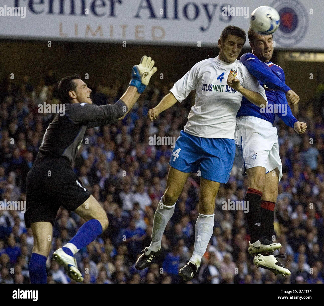 Rangers' Kris Boyd and FK Zeta Milan Radulovic leap for the ball during ...