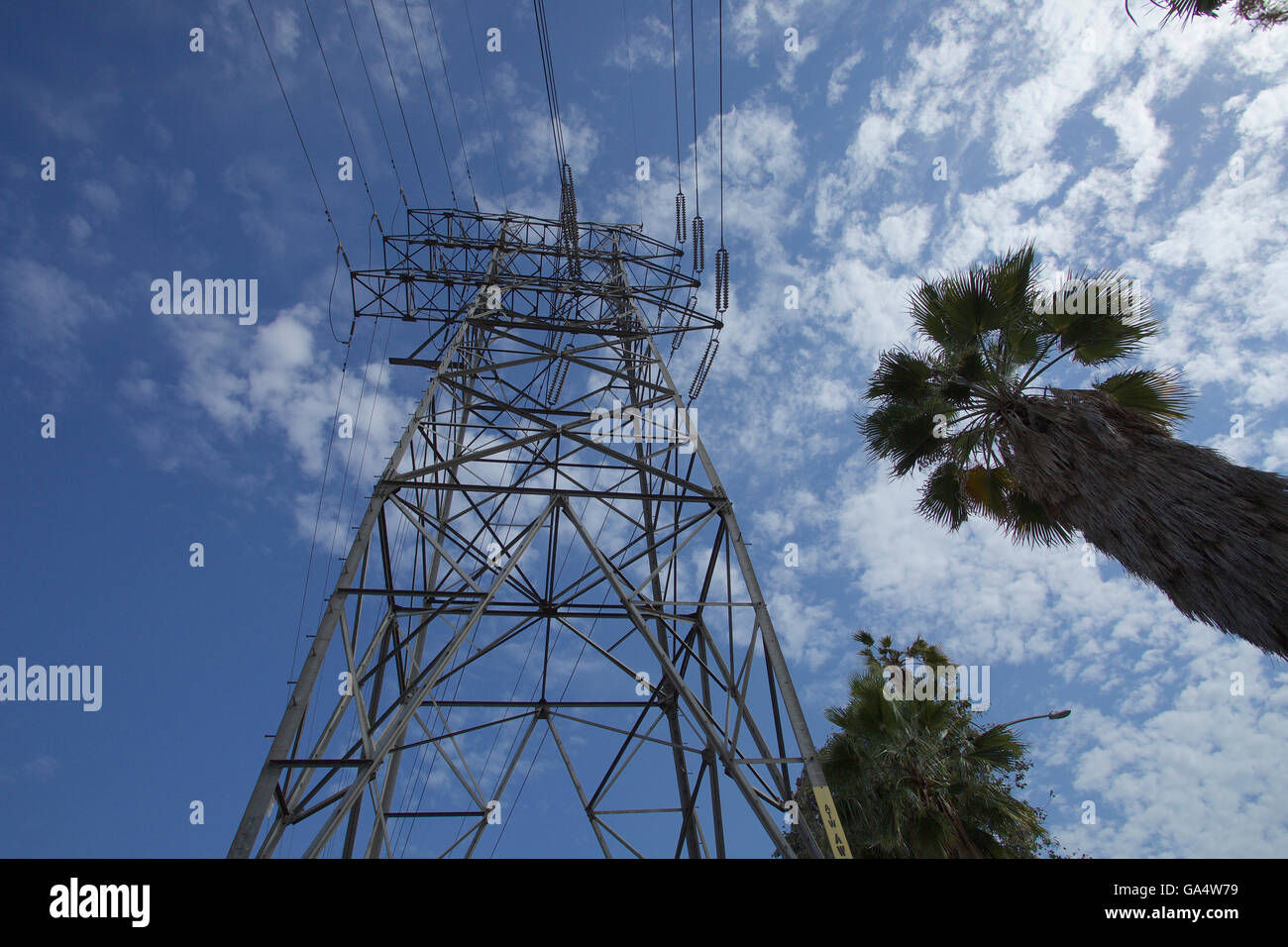 High power lines with a blue sky and clouds Stock Photo - Alamy