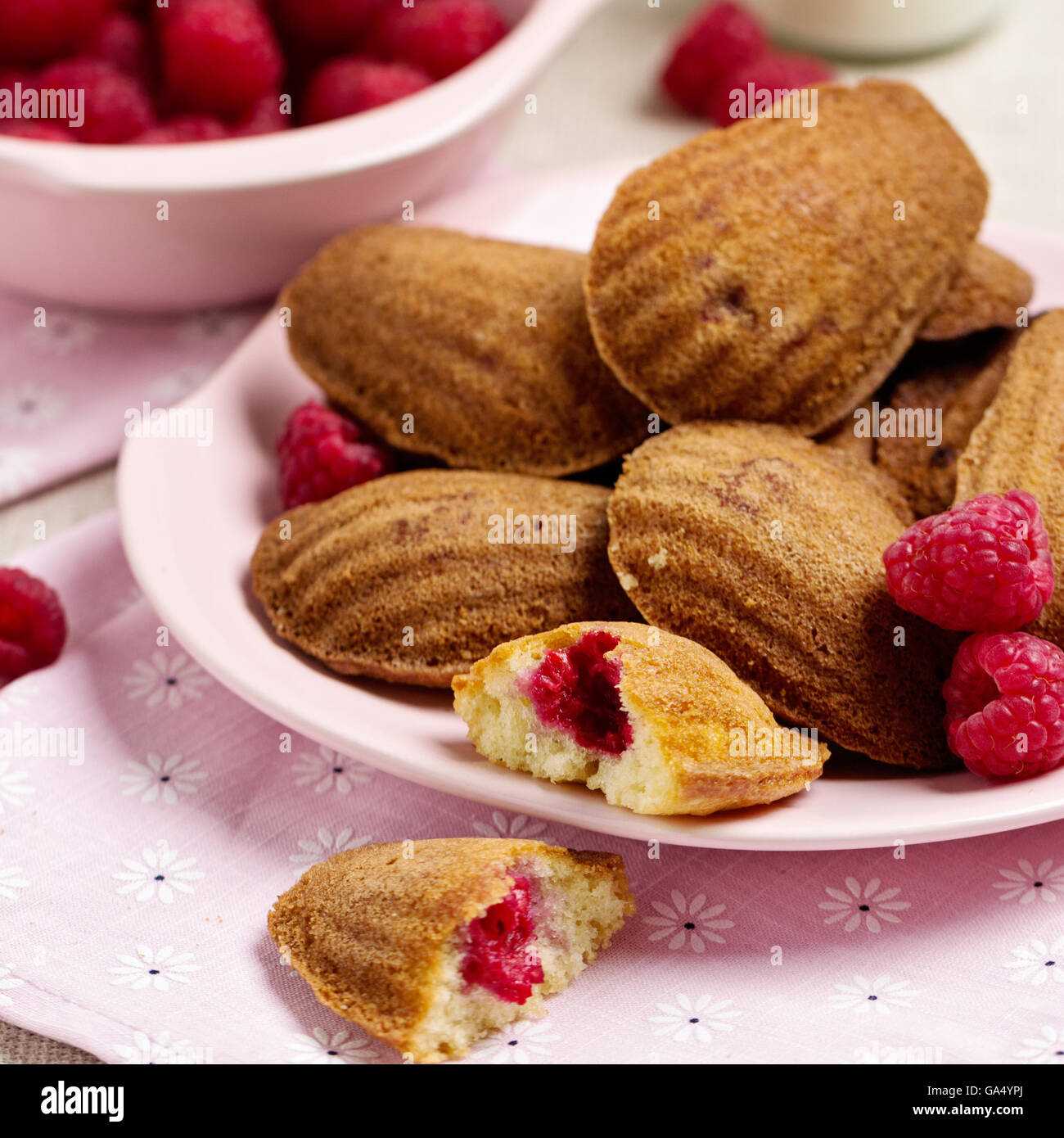 French pastry Madeleine with raspberries. Selective focus Stock Photo ...