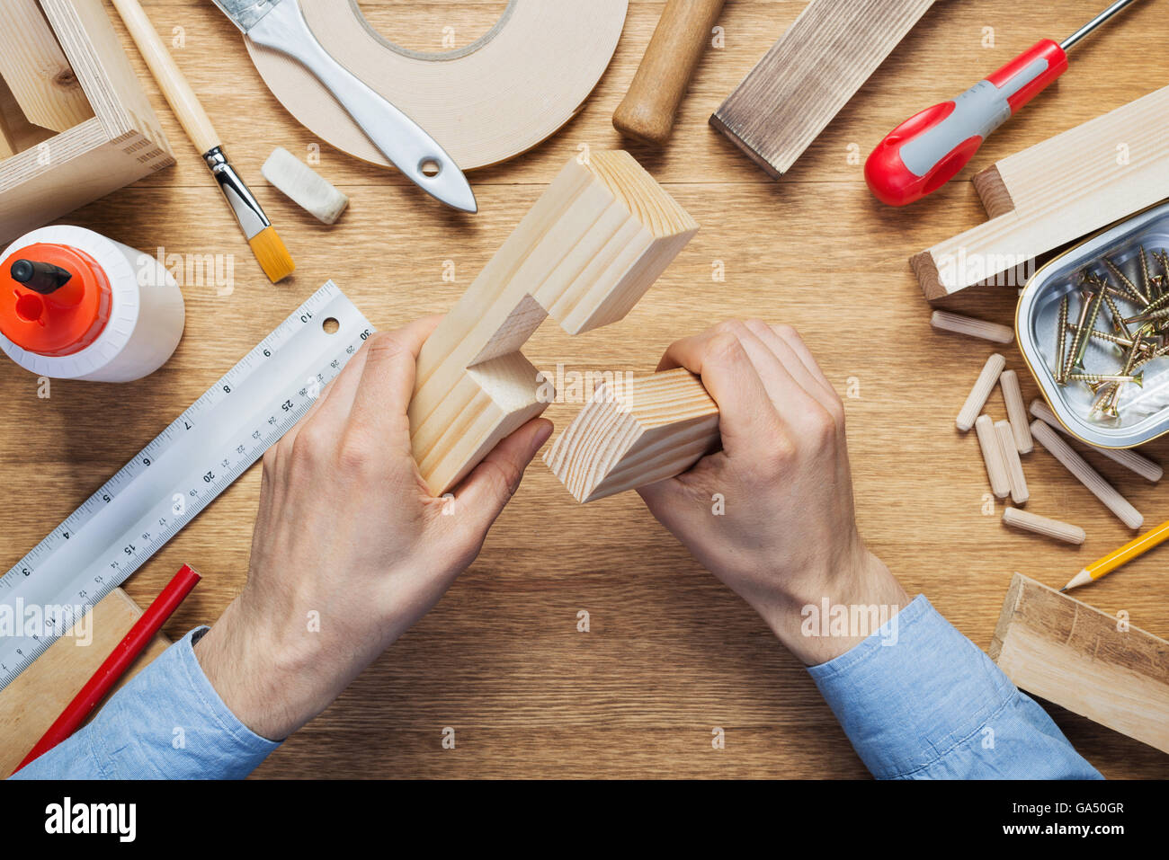 Woodworking workshop table top scene. Making of wood joint. DIY concept ...