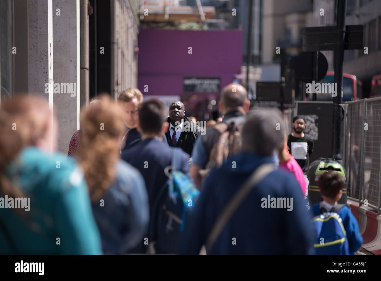 London, a man walking in the crowd Stock Photo - Alamy