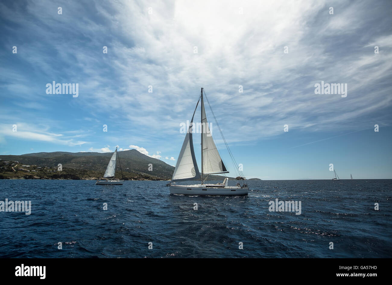Beautiful yacht sailing on the sea near the island coast Stock Photo ...