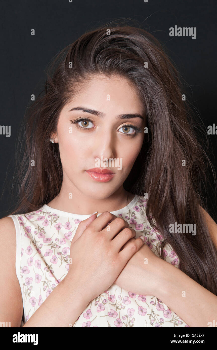 Beautiful woman hands over heart Stock Photo - Alamy