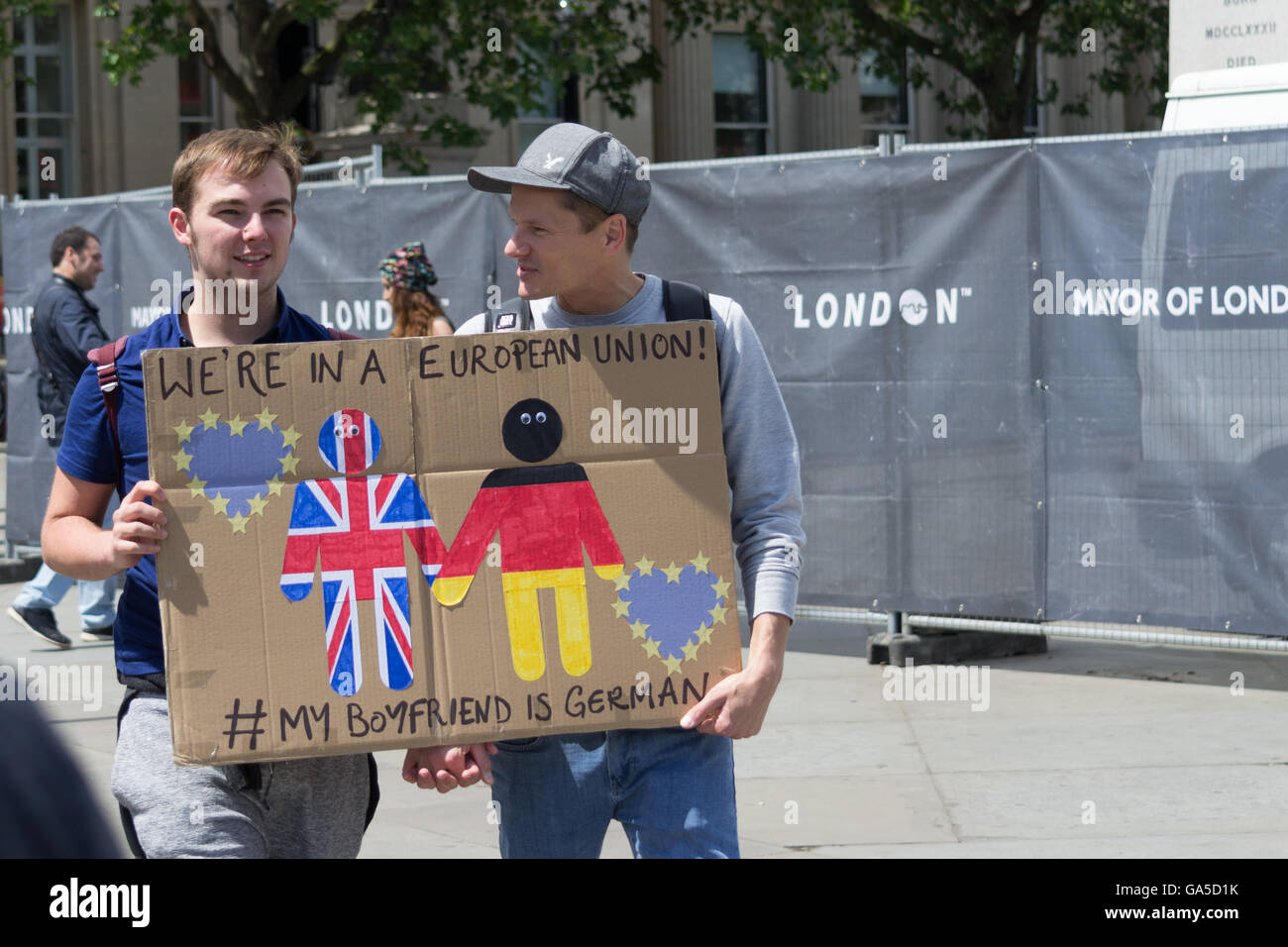 London, UK. 2nd July, 2016. Gay couple... Crowds on a march through ...