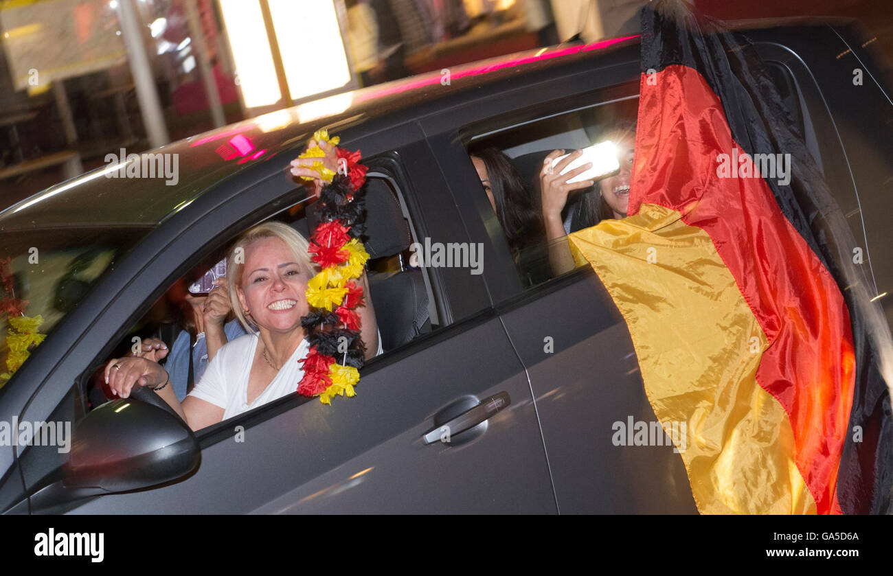Berlin, Germany. 03rd July, 2016. German soccer fans celebrate their ...