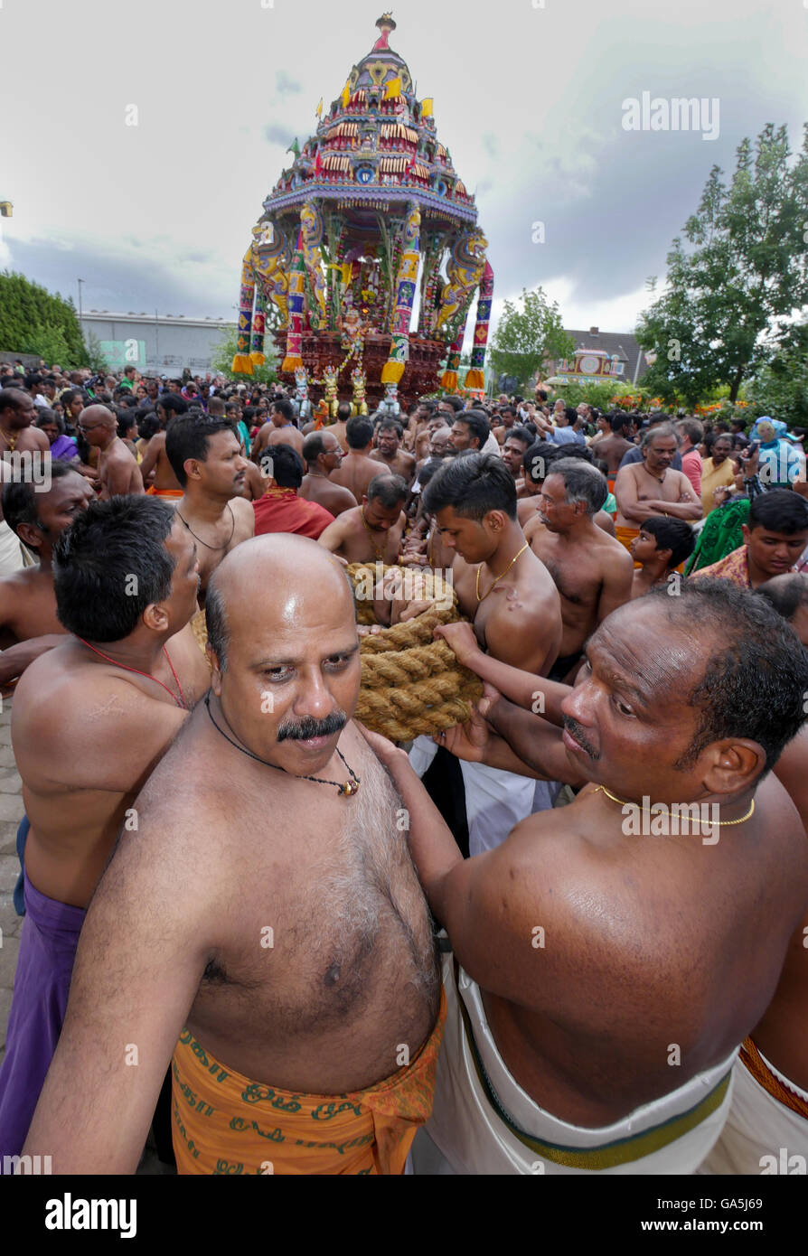 Believer pull the temple car of the goddess in the procession with a ...