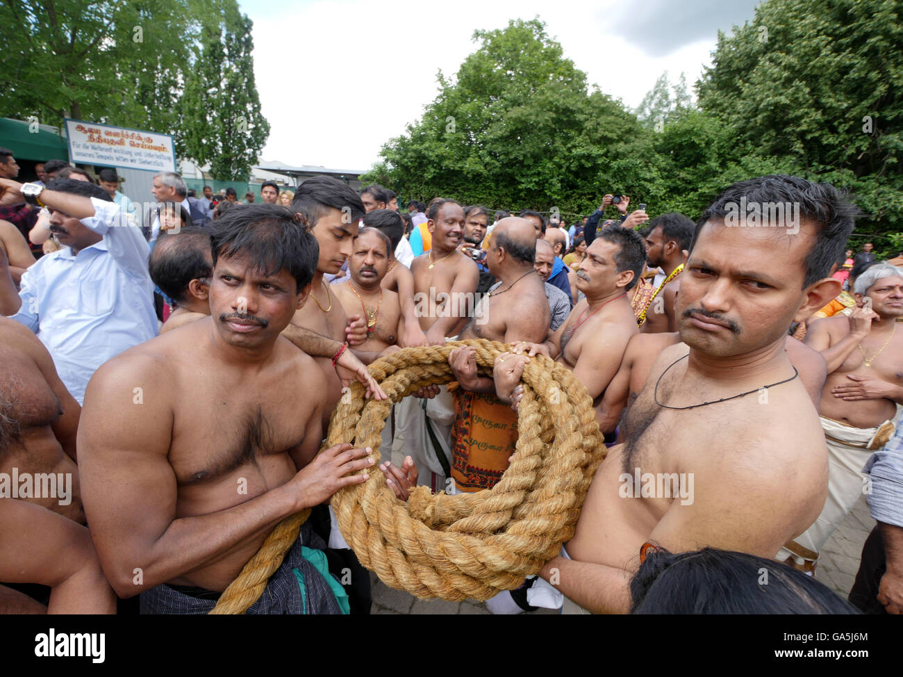 Believer pull the temple car of the goddess in the procession with a ...