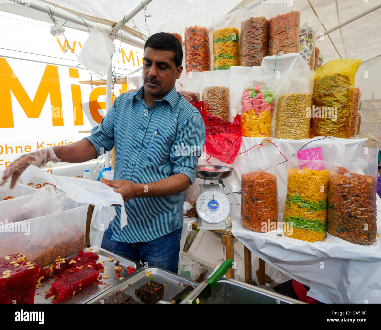 Dealer with sweets at the temple feast, Sri Kamadchi-Ampal Temple ...