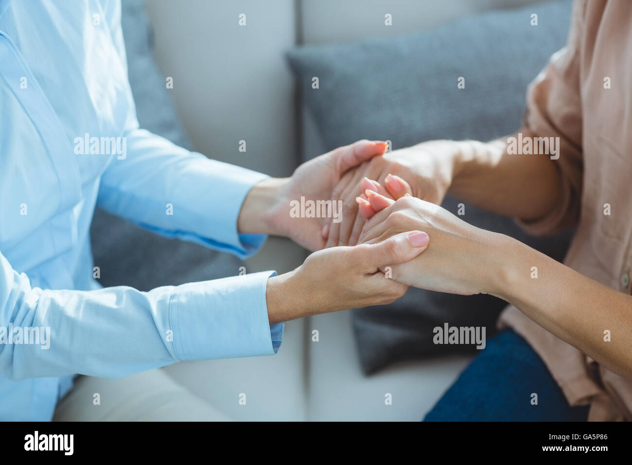 Female patient holding hands hi-res stock photography and images - Alamy