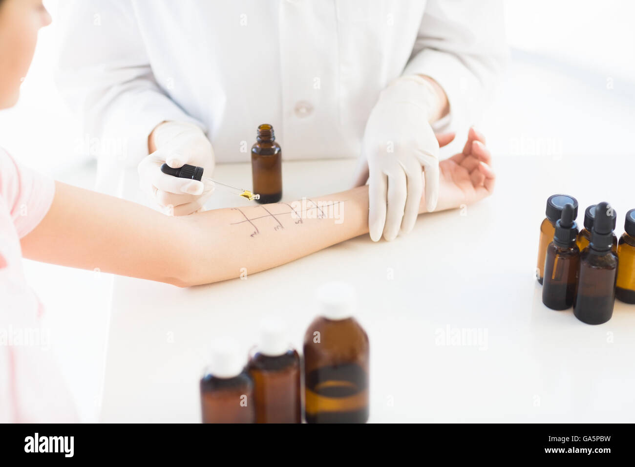 Midsection of doctor dropping medicine on patient hand Stock Photo - Alamy