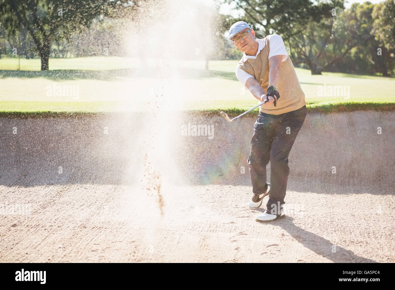 Sportsman playing golf Stock Photo - Alamy