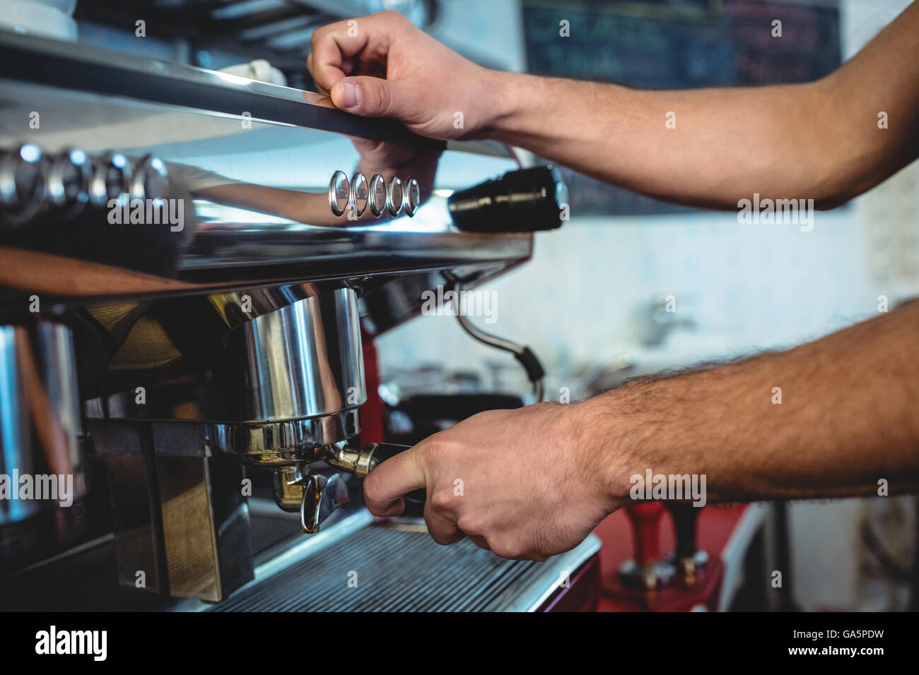 Close-up of barista using espresso machine at coffee house Stock Photo ...