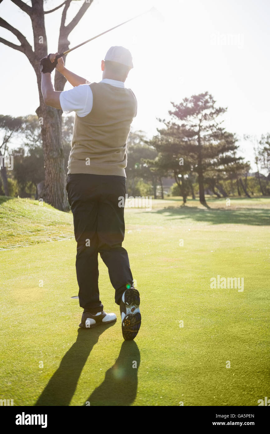 Rear view of sportsman playing golf Stock Photo - Alamy