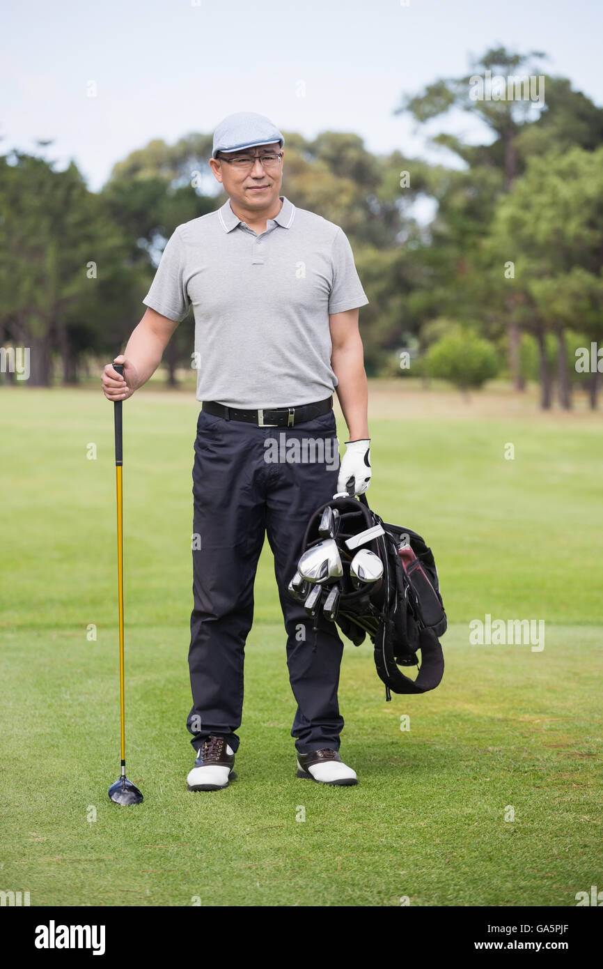 Portrait of golfer standing Stock Photo - Alamy