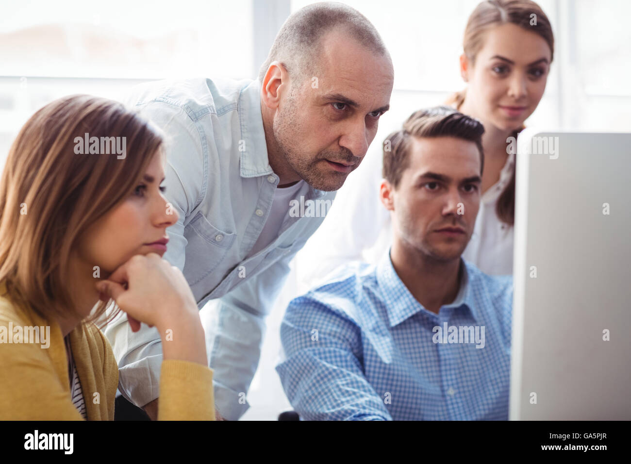 business people looking at laptop Stock Photo - Alamy