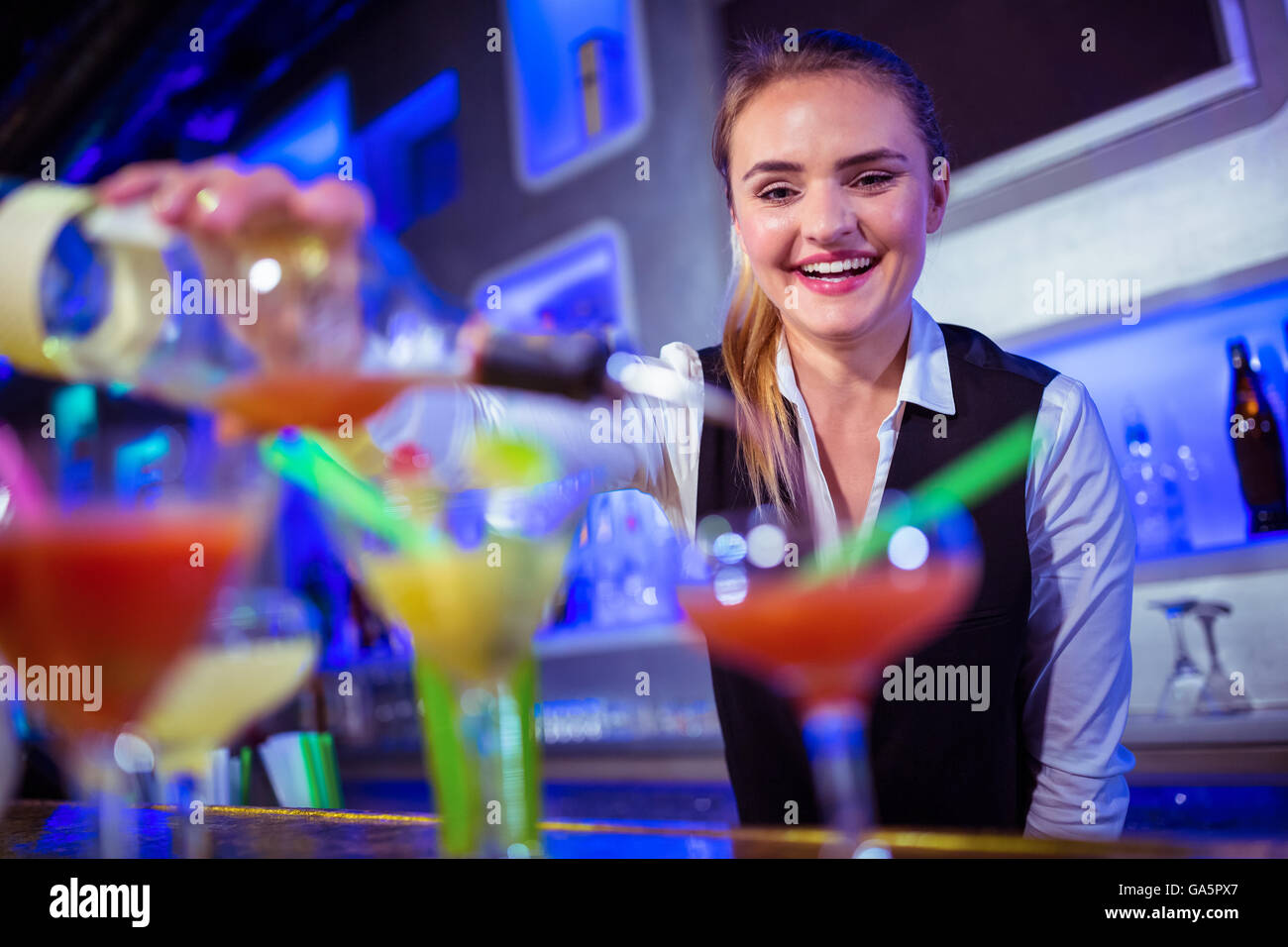 Woman barmaid pouring bottle hi-res stock photography and images - Alamy
