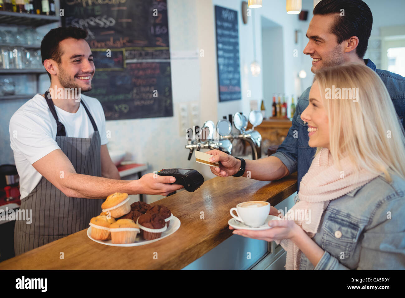 Paying customers with debit credit card hi-res stock photography and ...