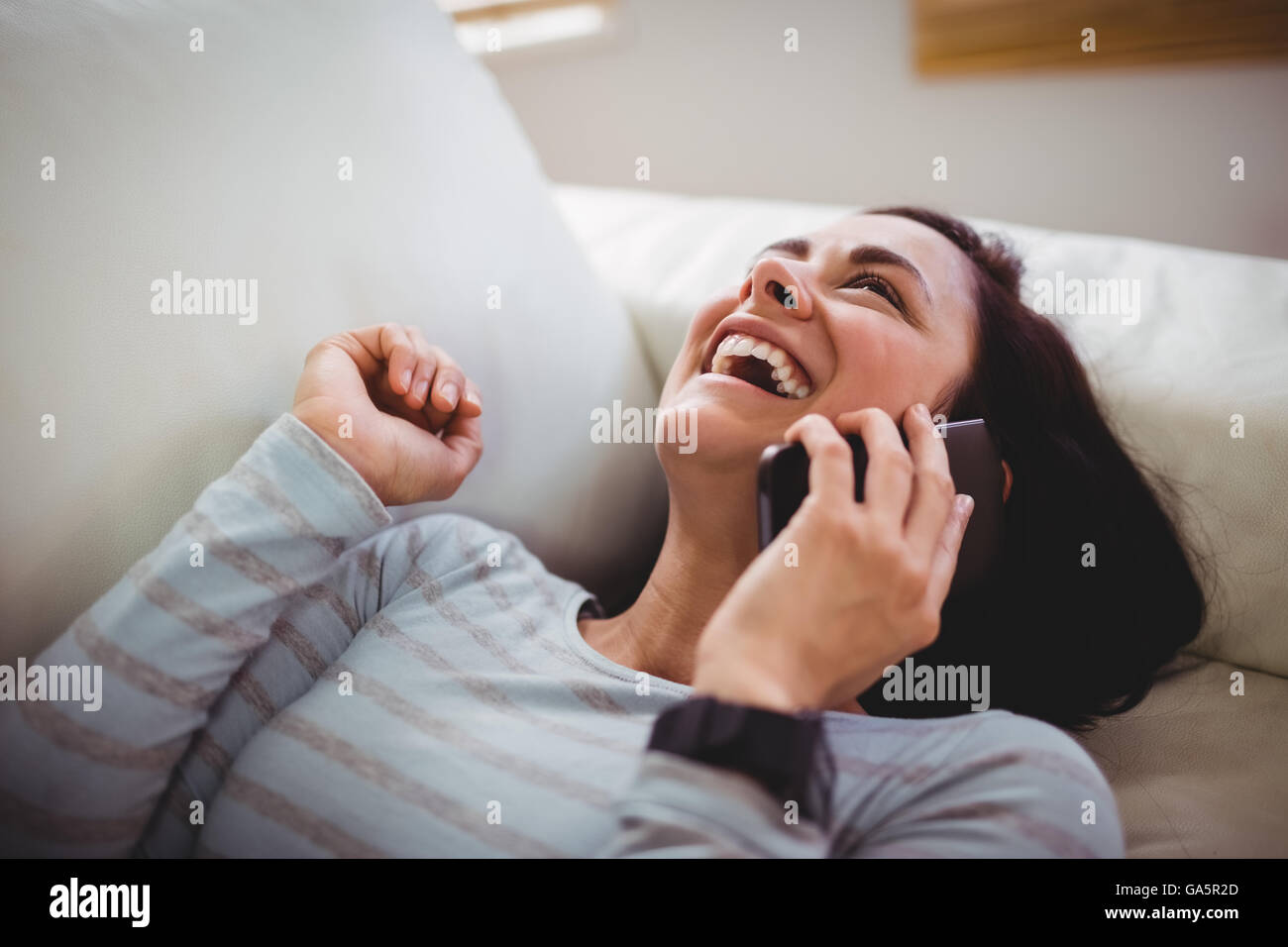 Woman laughing talking on hi-res stock photography and images - Alamy