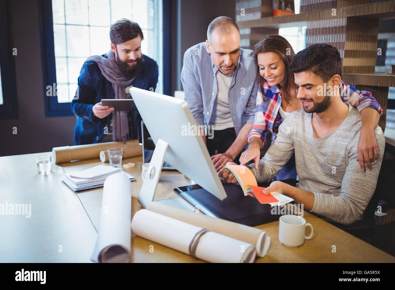 Female coworkers discussing over hi-res stock photography and images ...