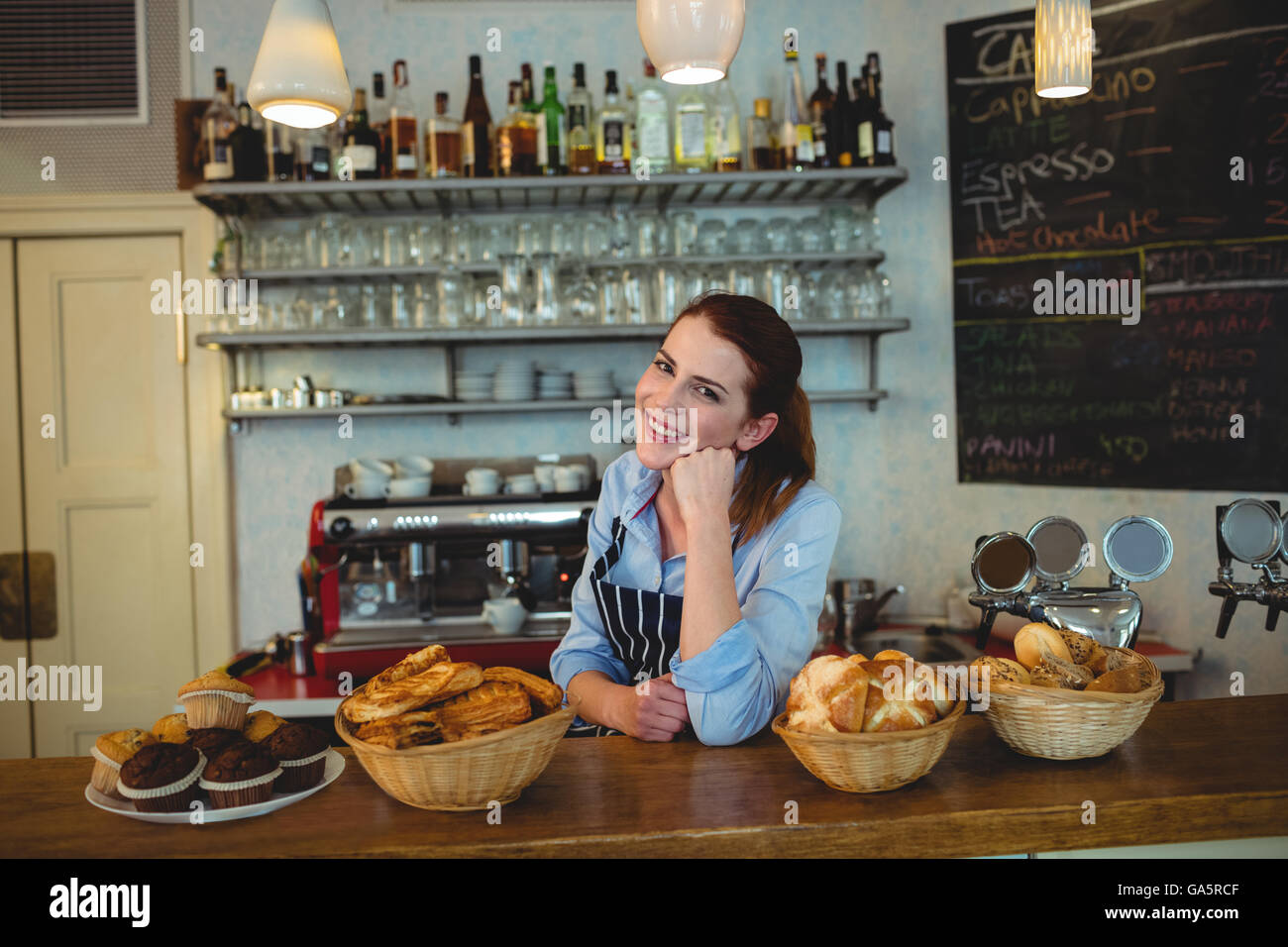 Portrait of happy shop owner at counter in coffee house Stock Photo - Alamy
